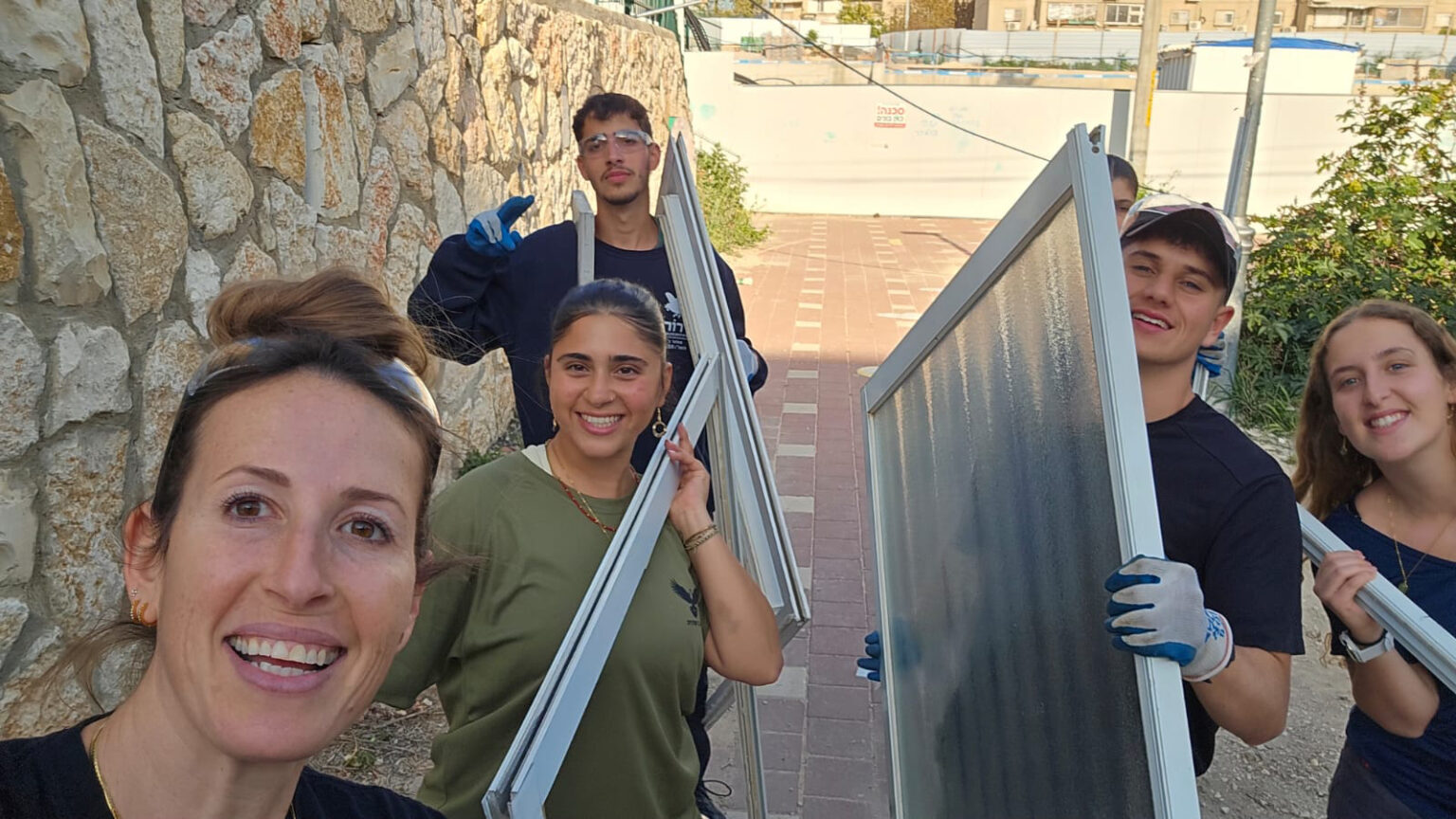 Kibbutz volunteers repair Iranian-bombed Beit Shemesh – San Diego ...